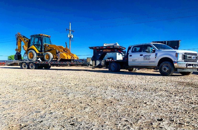 Backhoe | Emco OilField - Permian Basin Transportation Service